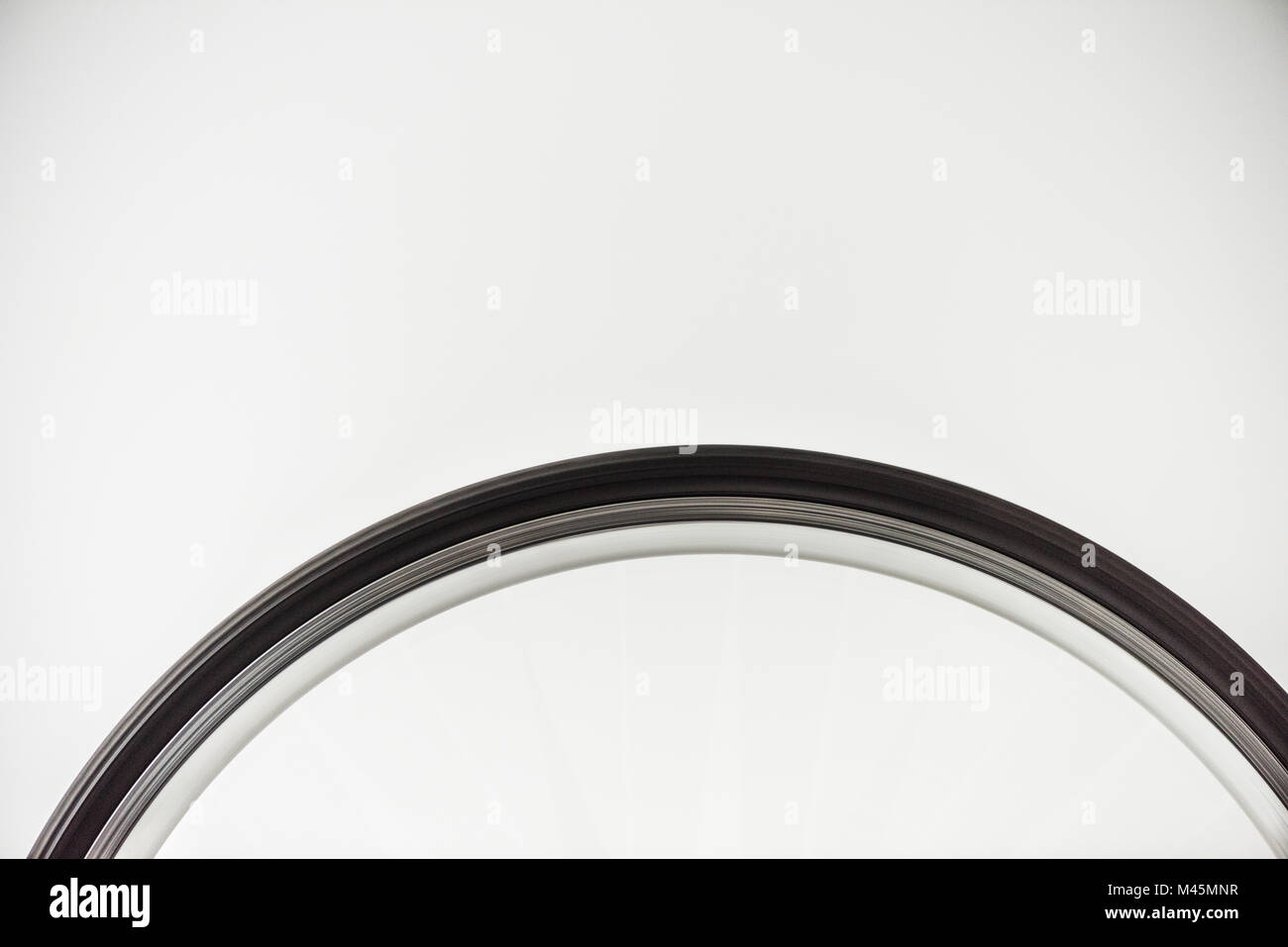 bicycle wheel in motion isolated on white Stock Photo - Alamy