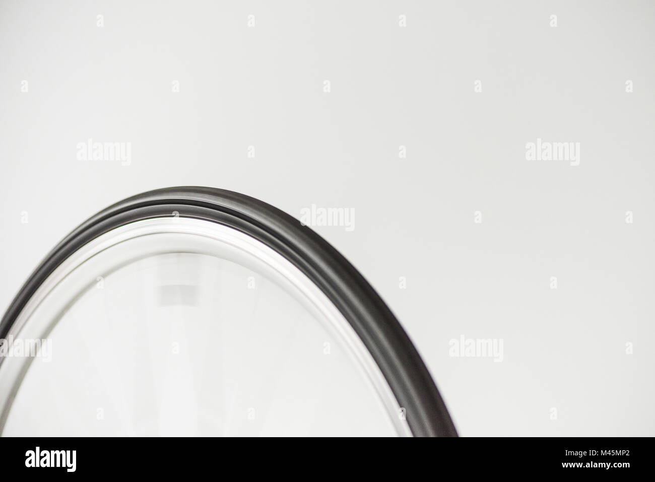 bicycle wheel in motion isolated on white Stock Photo - Alamy