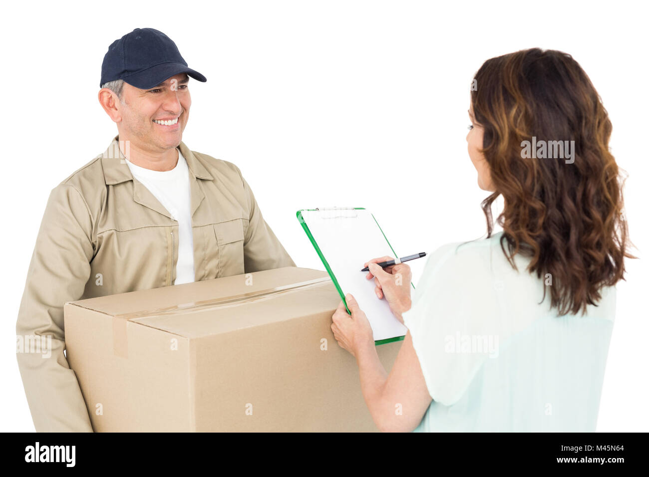 Happy delivery man giving package to customer Stock Photo - Alamy