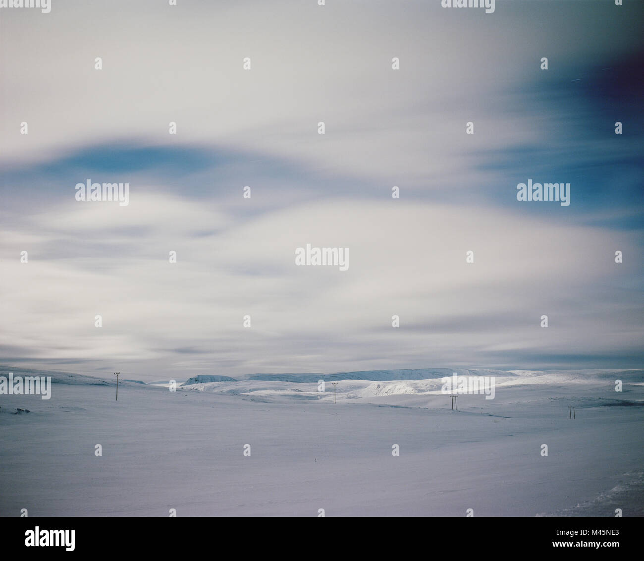 Illuminated moonlit snow covered landscape at polar night, Finnmark ...