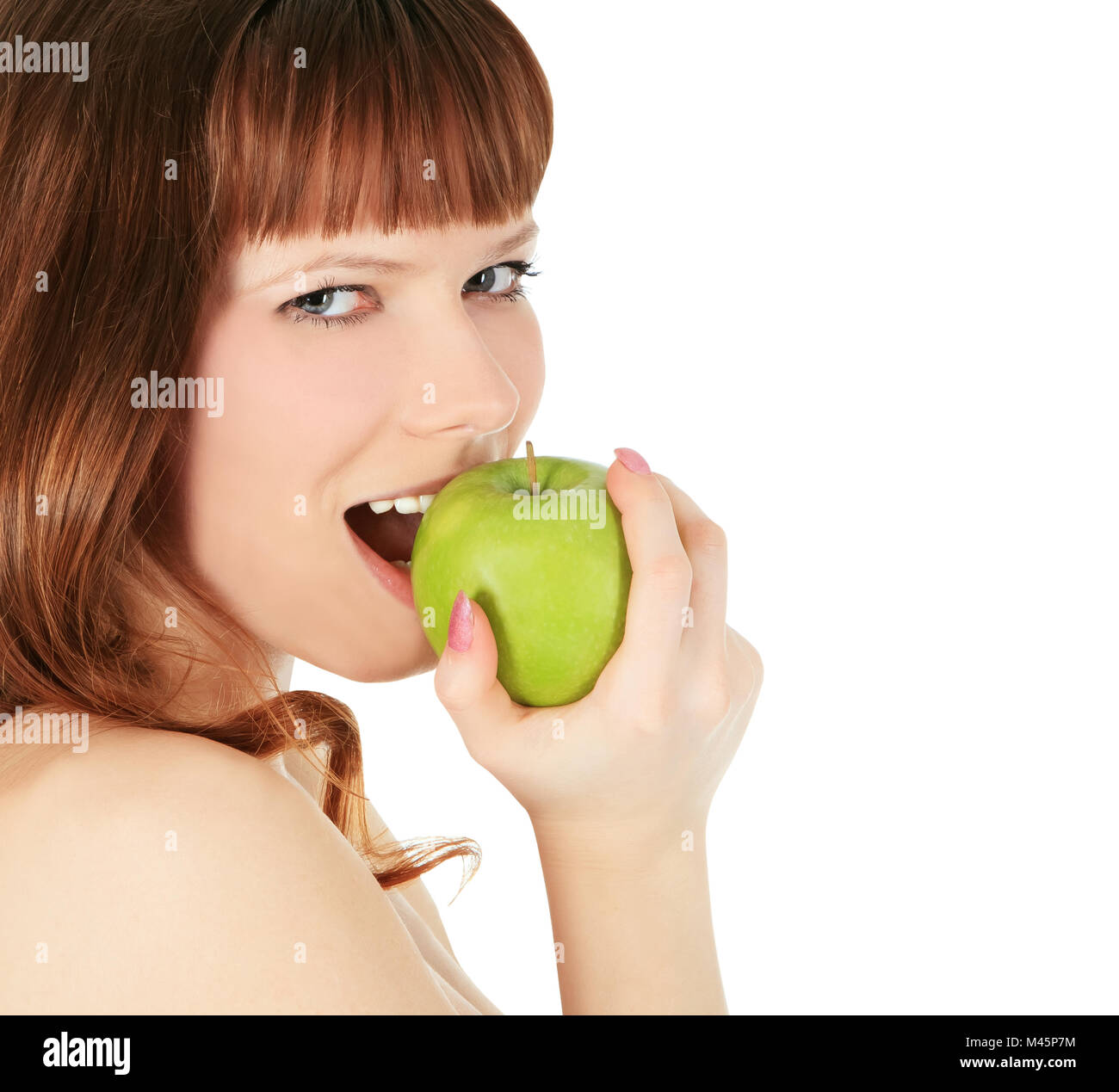 woman eating a green apple isolated over white background Stock Photo ...