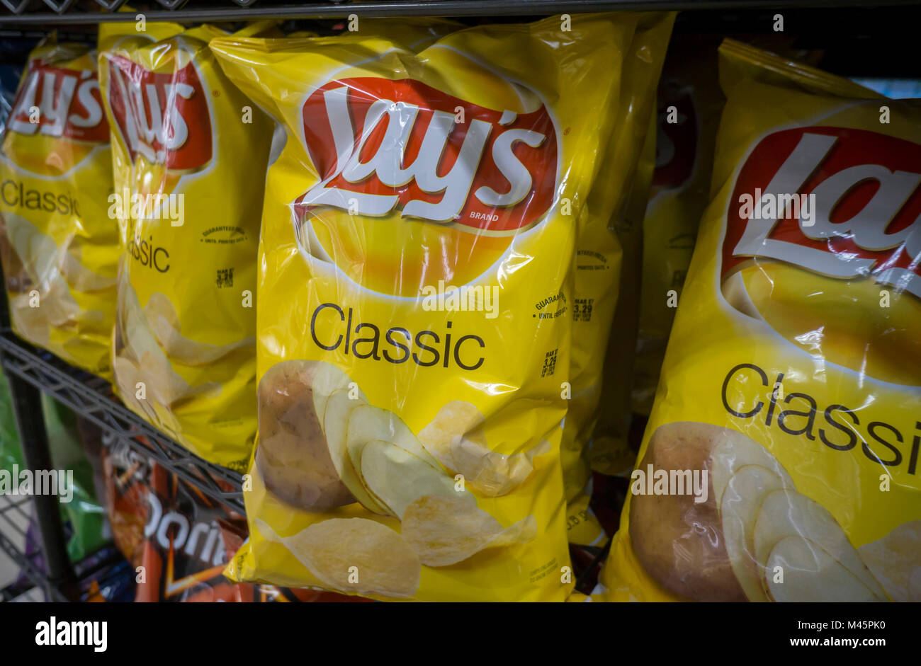 A display of PepsiCo Frito-Lay potato chip snacks in a supermarket in ...