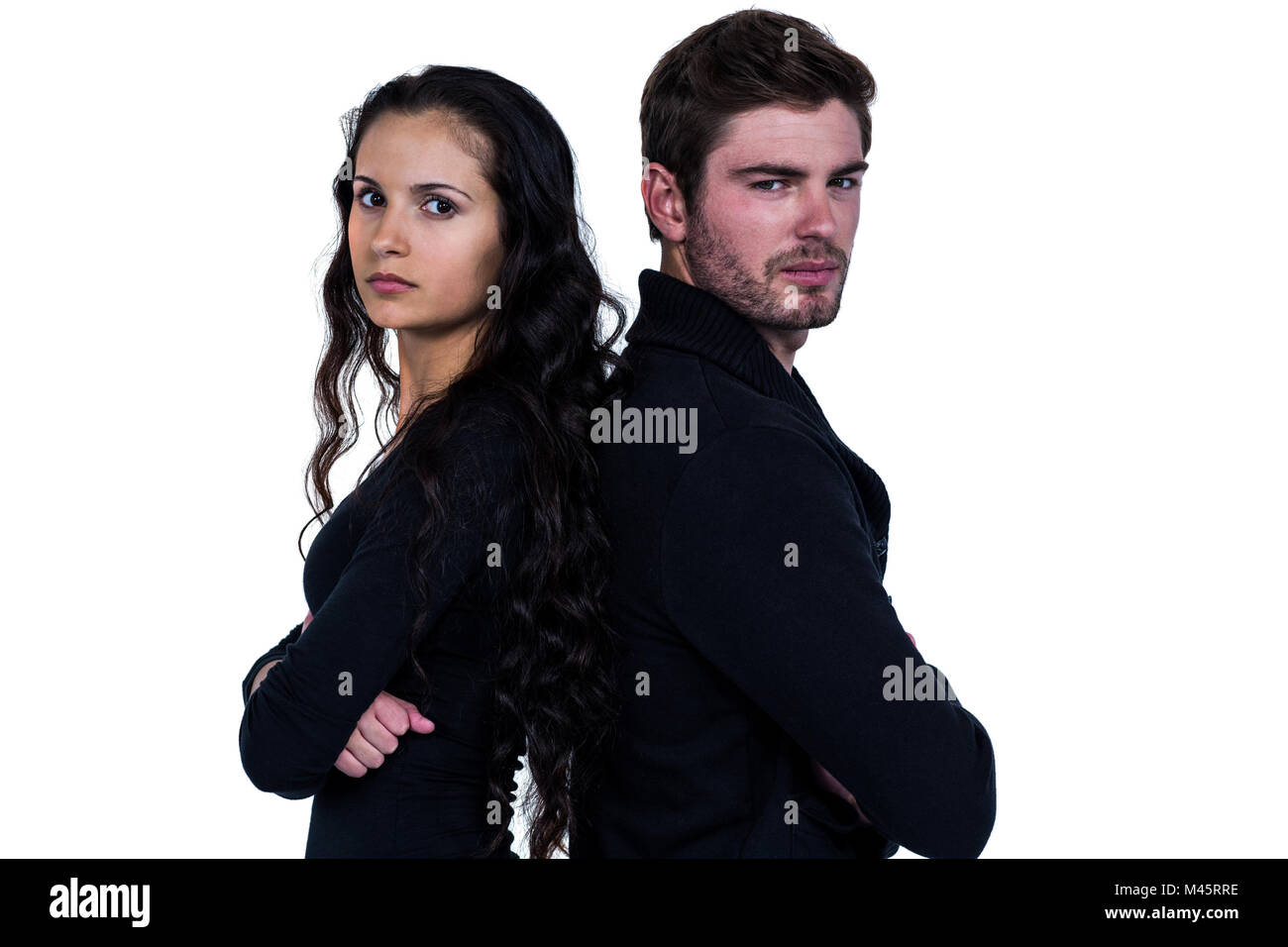Couple back to back not talking after an argument Stock Photo - Alamy