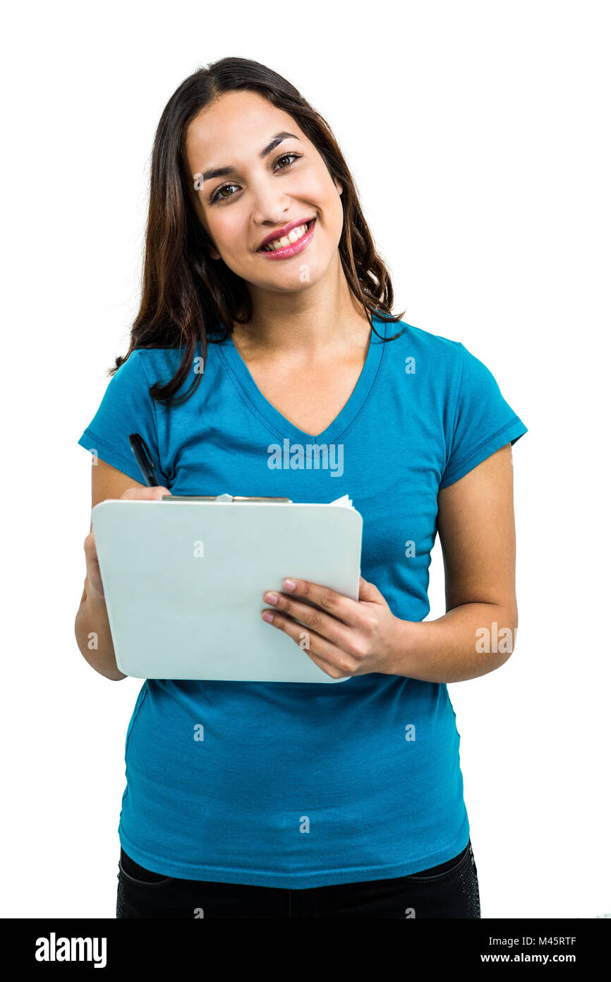 Portrait of beautiful woman writing in notepad Stock Photo - Alamy