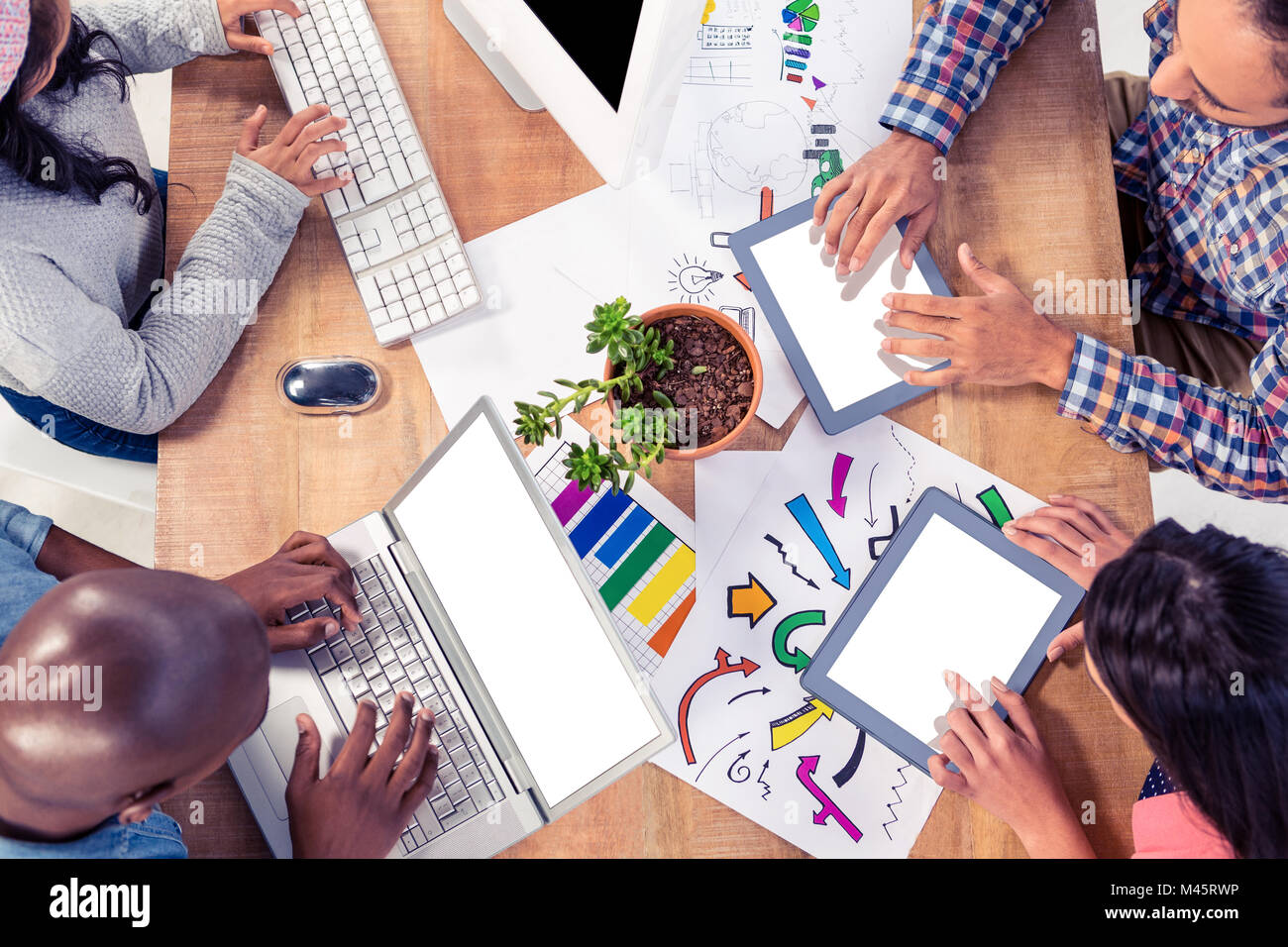 Business people using technologies at desk in office Stock Photo - Alamy