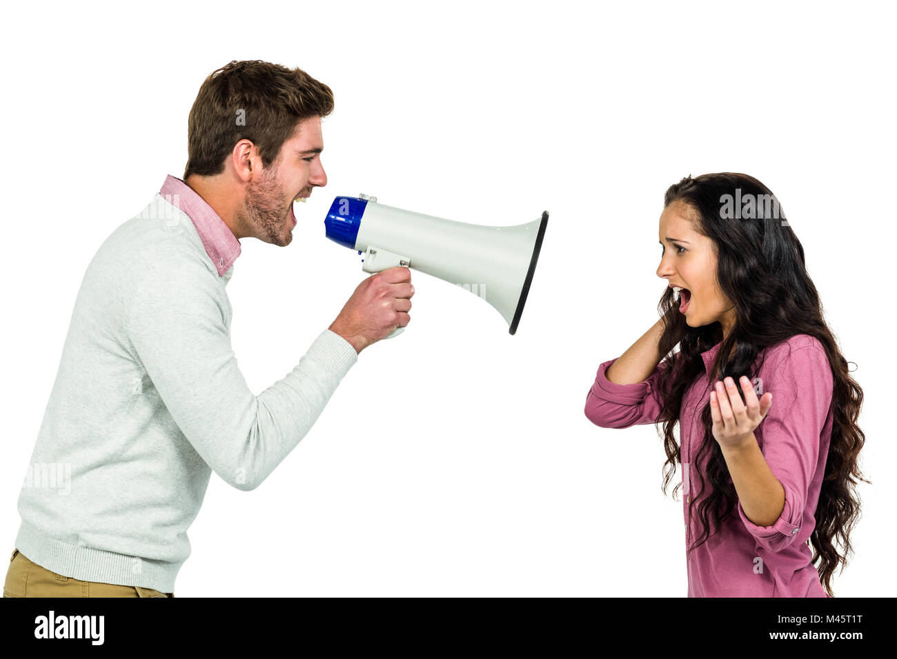 Screaming couple with man holding loudspeaker Stock Photo - Alamy