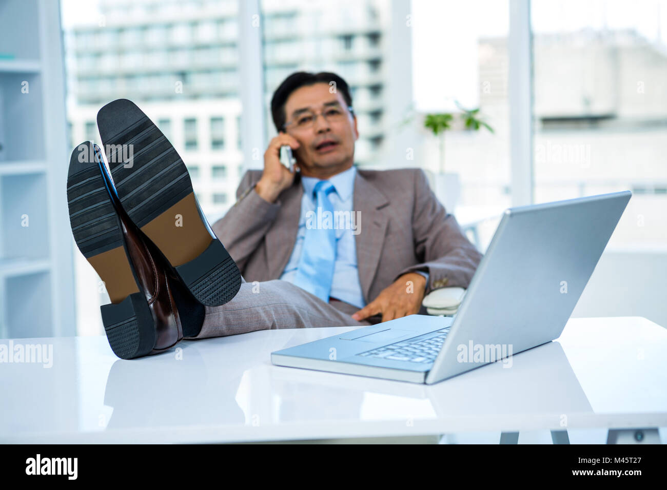Feet on the desk hi-res stock photography and images - Alamy