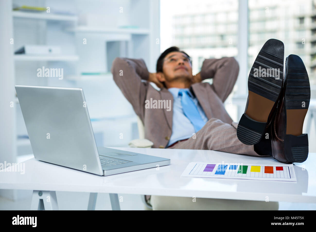 Feet on desk suit hi-res stock photography and images - Alamy
