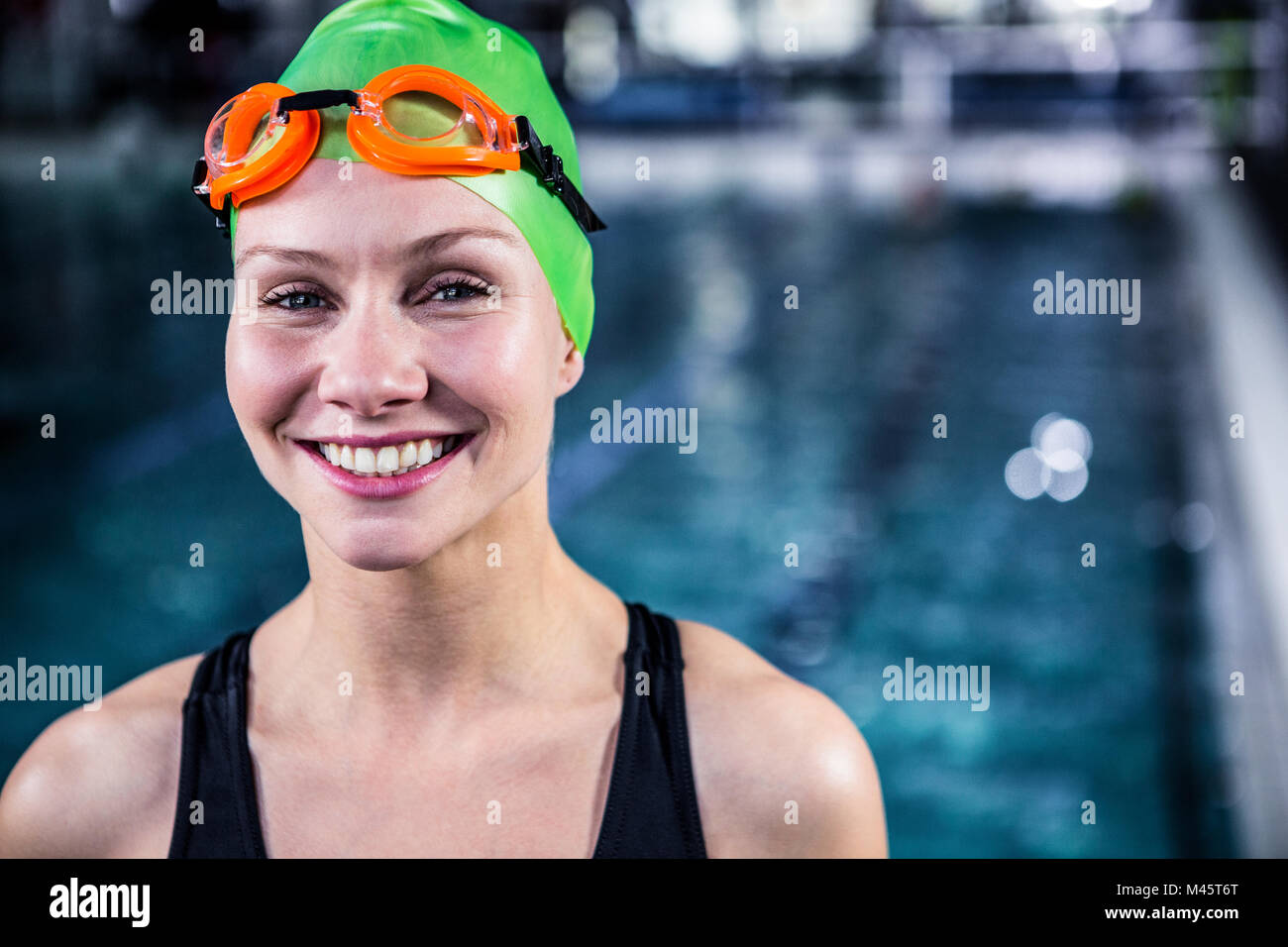 Portrait of a woman swimmer looking the camera Stock Photo - Alamy