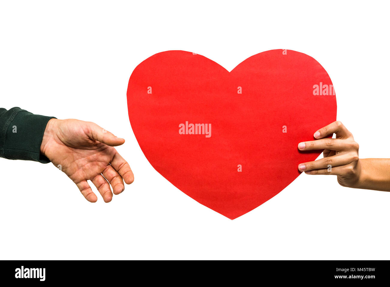 Cropped hand of woman giving heart shaped paper to man Stock Photo - Alamy