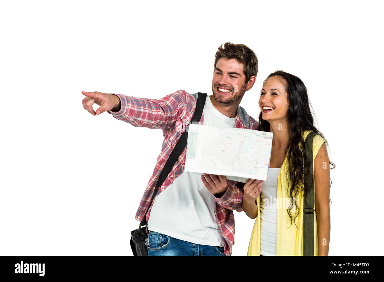Smiling couple holding map while pointing somewhere Stock Photo - Alamy