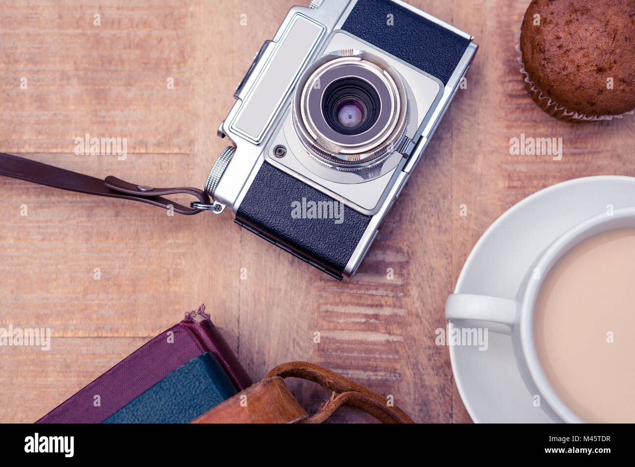 Directly above shot of old camera with diaries and coffee Stock Photo ...