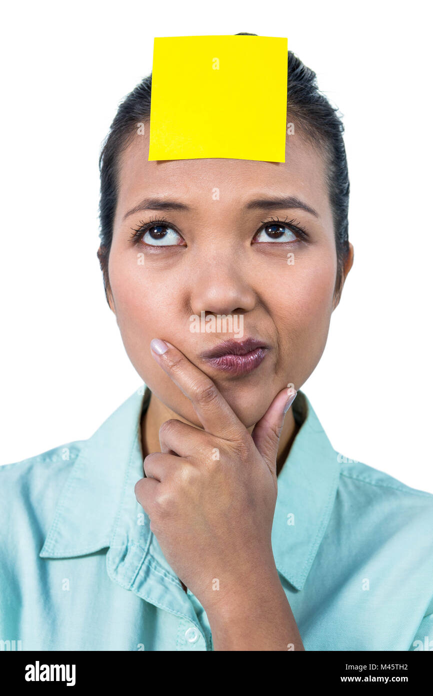 Businesswoman looking at the signe on her forehead Stock Photo - Alamy