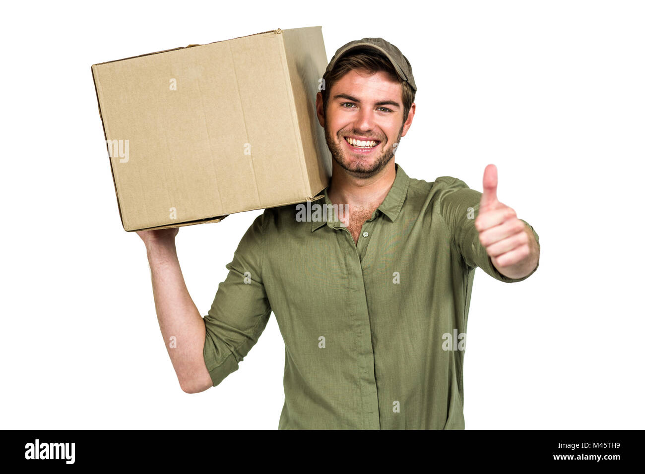 Handsome postman holding pack showing thumbs up Stock Photo - Alamy