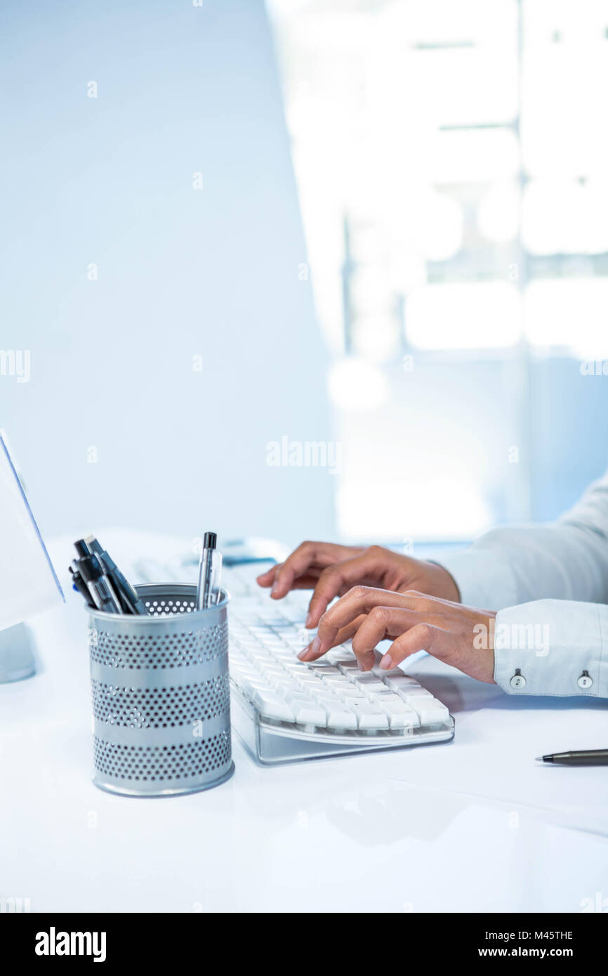Businesswomans hands typing on computer keyboard Stock Photo - Alamy