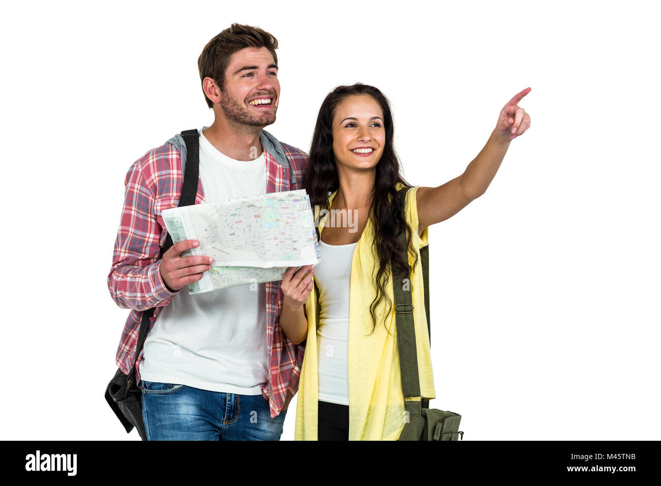 Happy couple holding map and pointing somewhere Stock Photo - Alamy