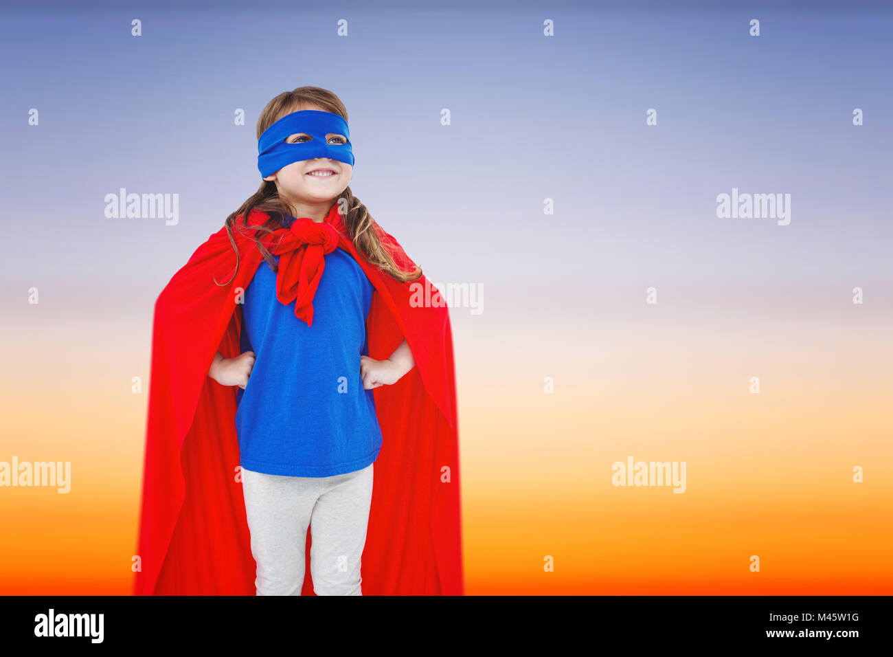 Composite image of masked girl pretending to be superhero Stock Photo ...