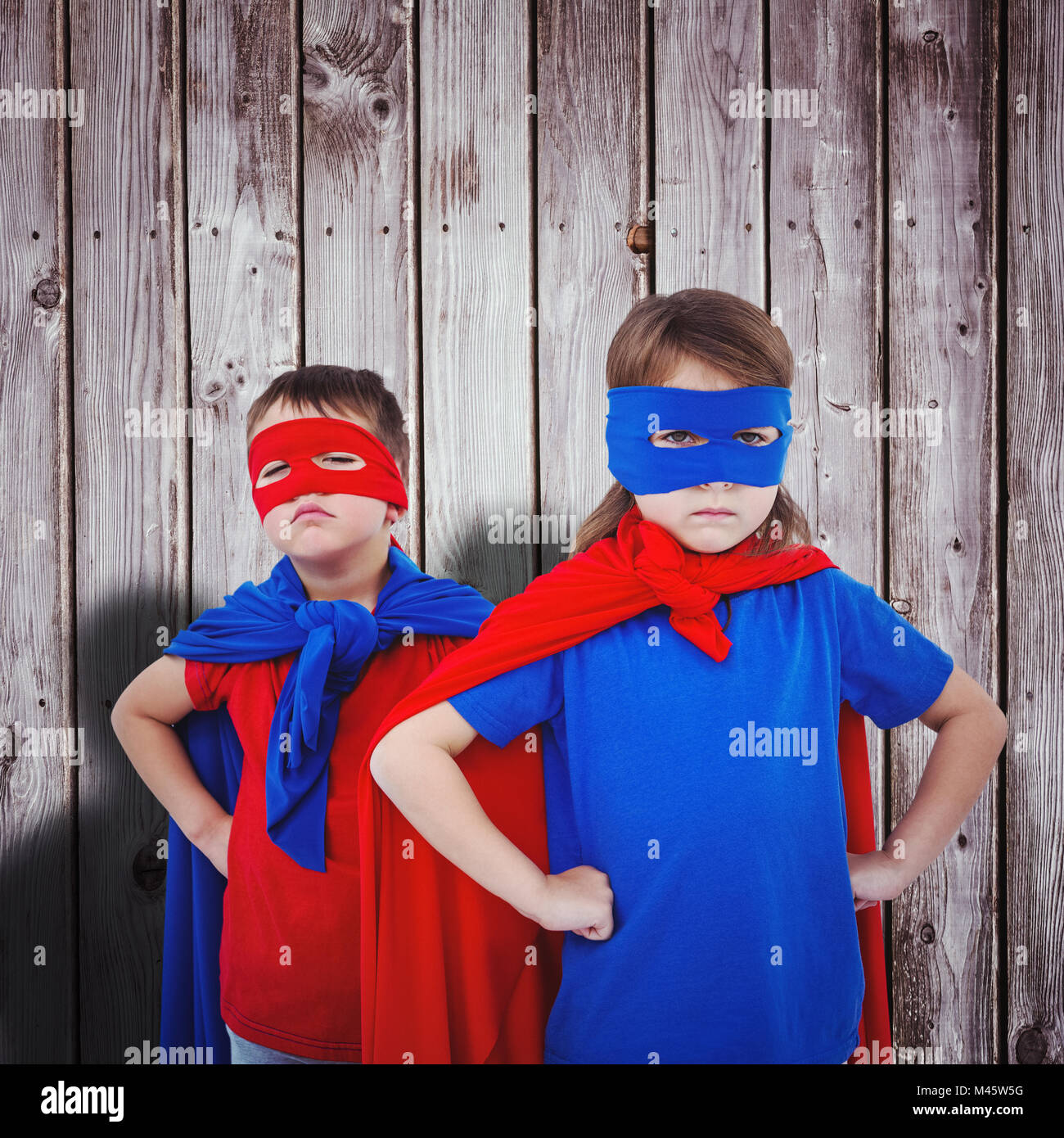 Composite image of masked kids pretending to be superheroes Stock Photo ...
