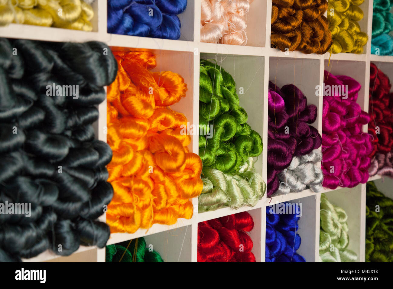 Threads in fabric factory shop in Mandalay Myanmar Stock Photo - Alamy