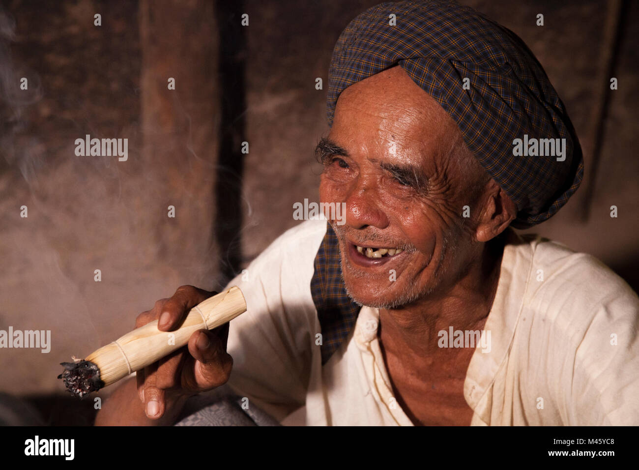 Myanmar man smoking smile hi-res stock photography and images - Alamy