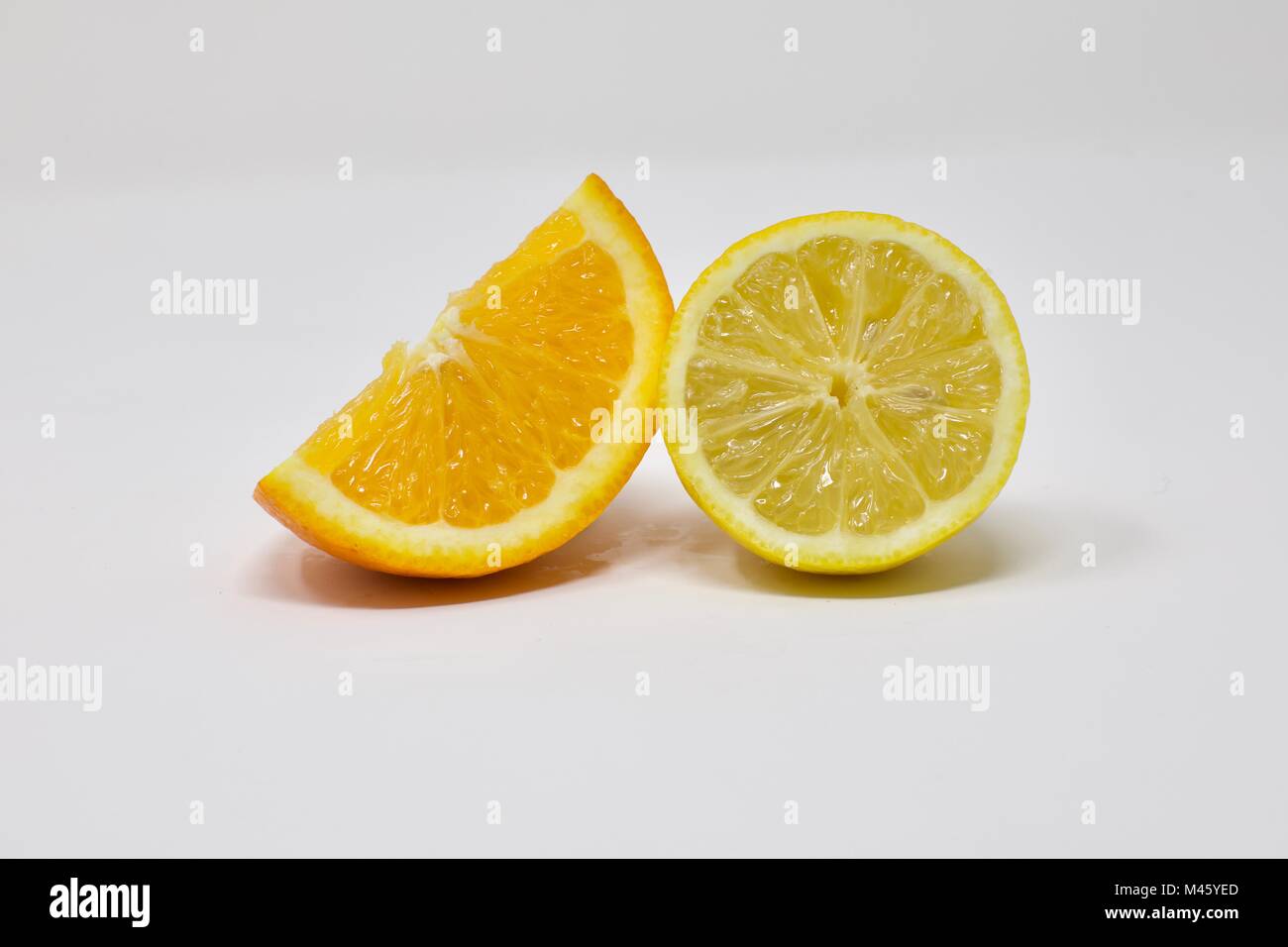 A quarter of a Orange (Citrus sinensis) and half a Lemon (Citrus limon ...