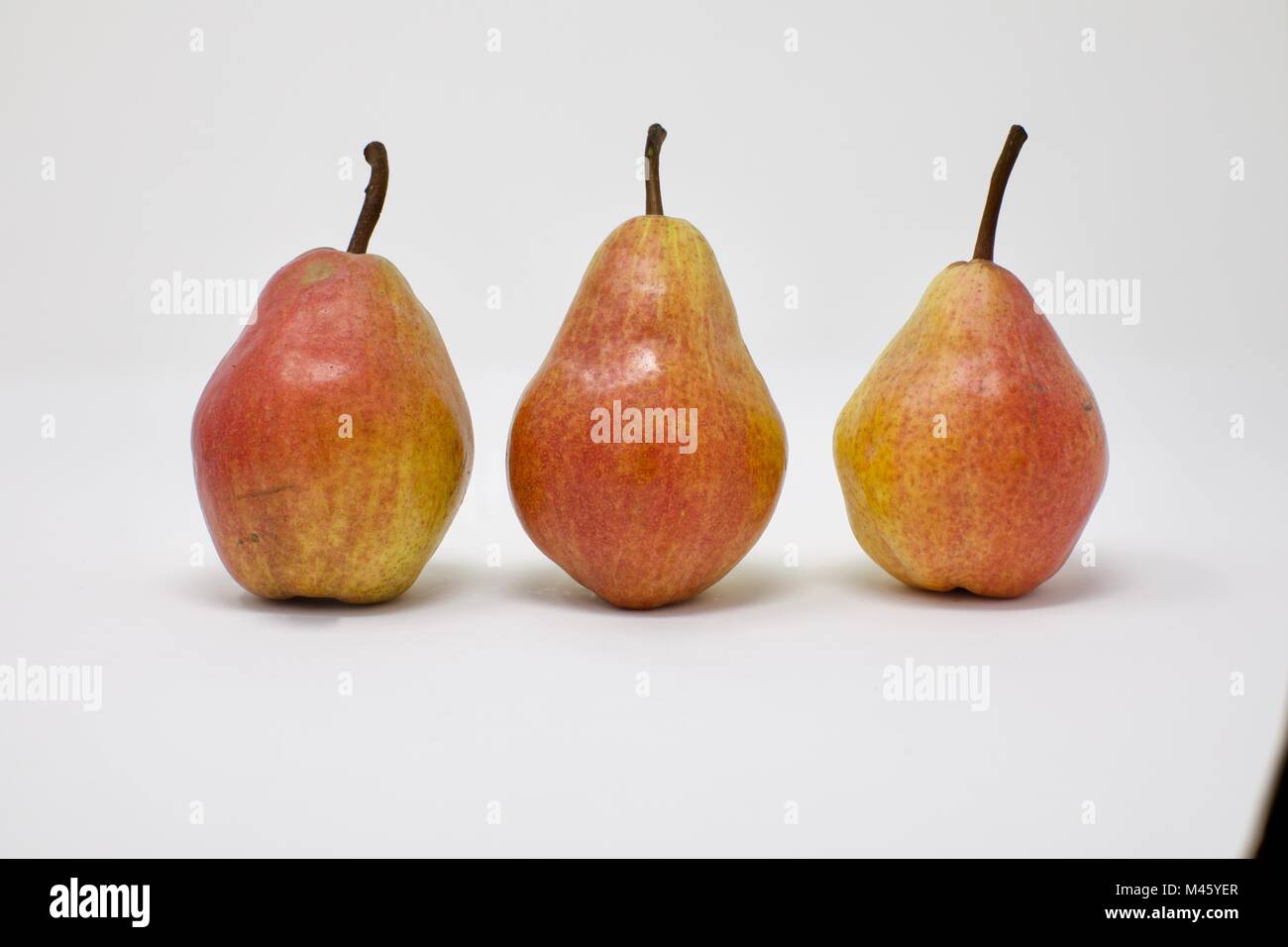 Three Red Williams Pears (Pyrus communis) on a white background Stock ...