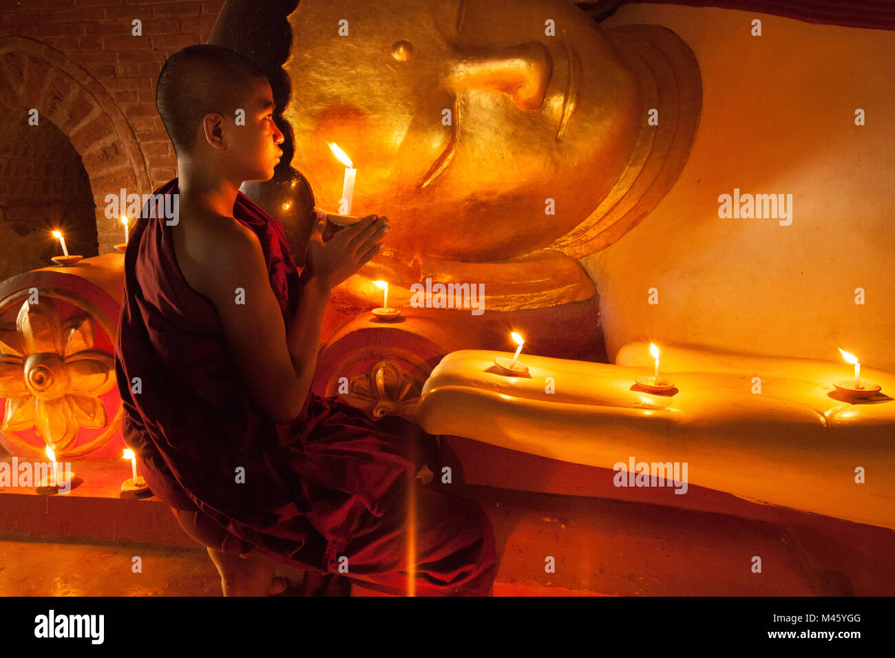 Young monk boy in traditional robes at a temple in Bagan Myanmar Stock ...