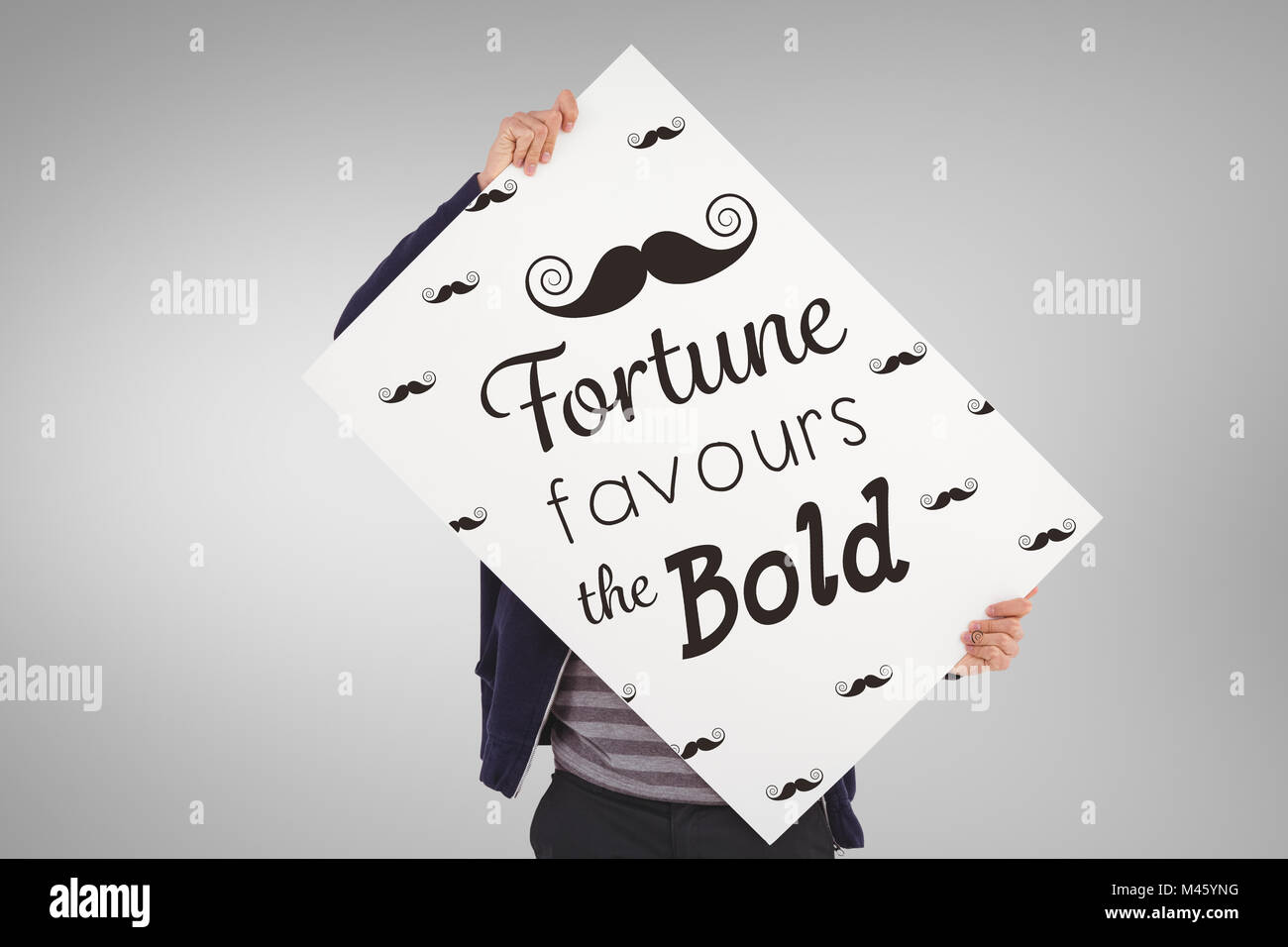 Composite image of man holding billboard in front of face Stock Photo ...