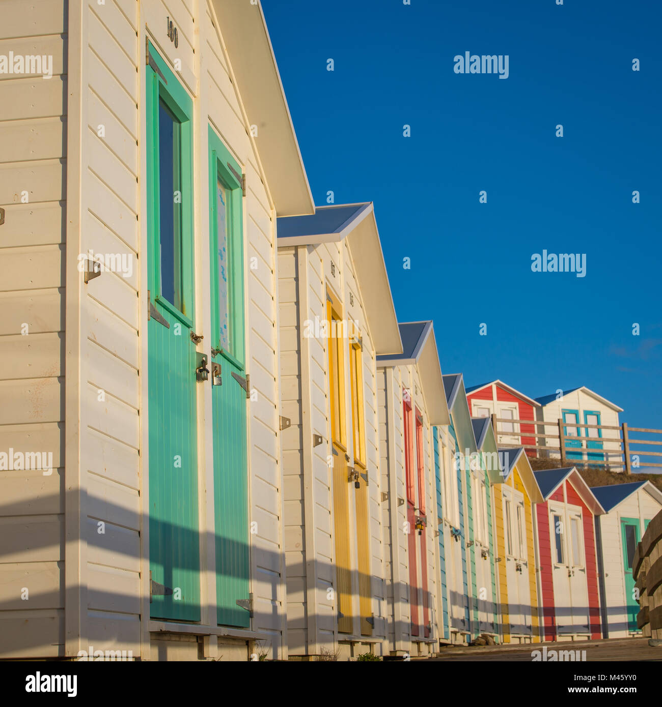 Traditional English beach huts above the beach in Cornwall Stock Photo ...