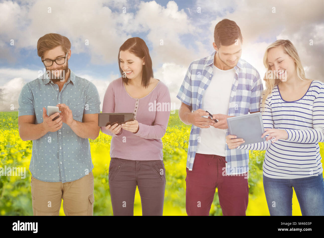 Composite image of smiling business people using electronic gadgets ...