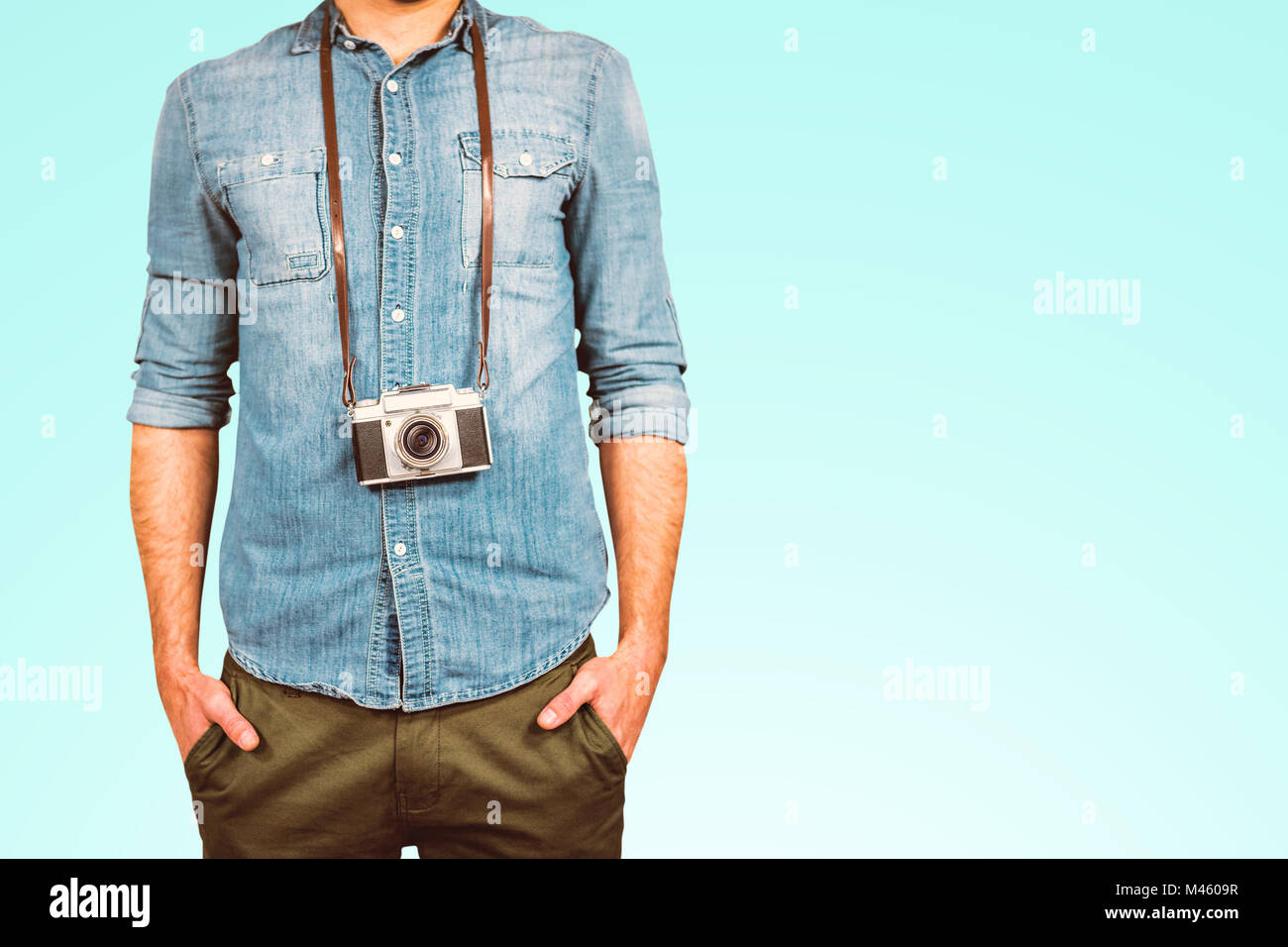 Composite image of hipster man holding digital camera Stock Photo - Alamy