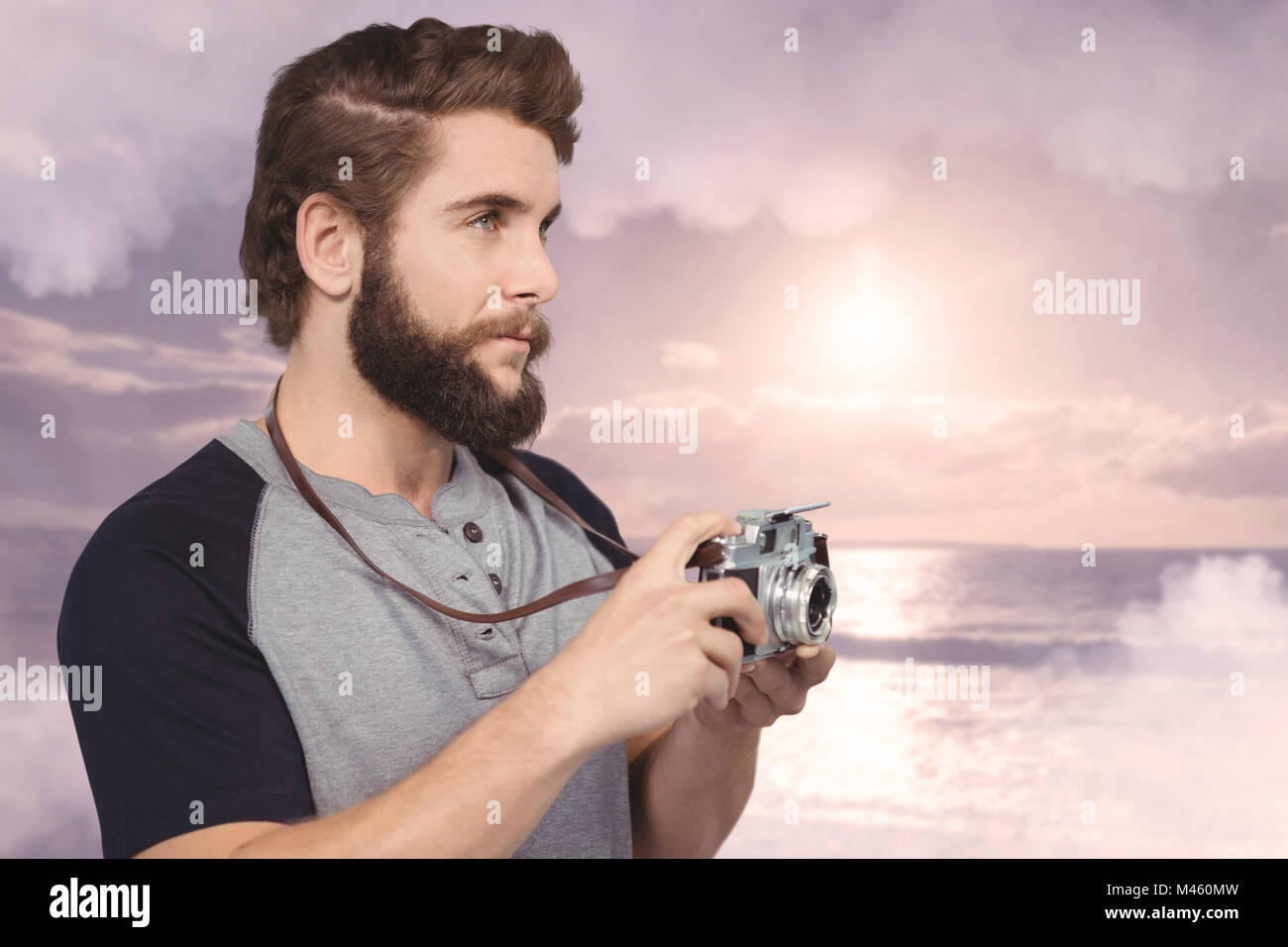 Composite image of hipster using digital camera Stock Photo - Alamy