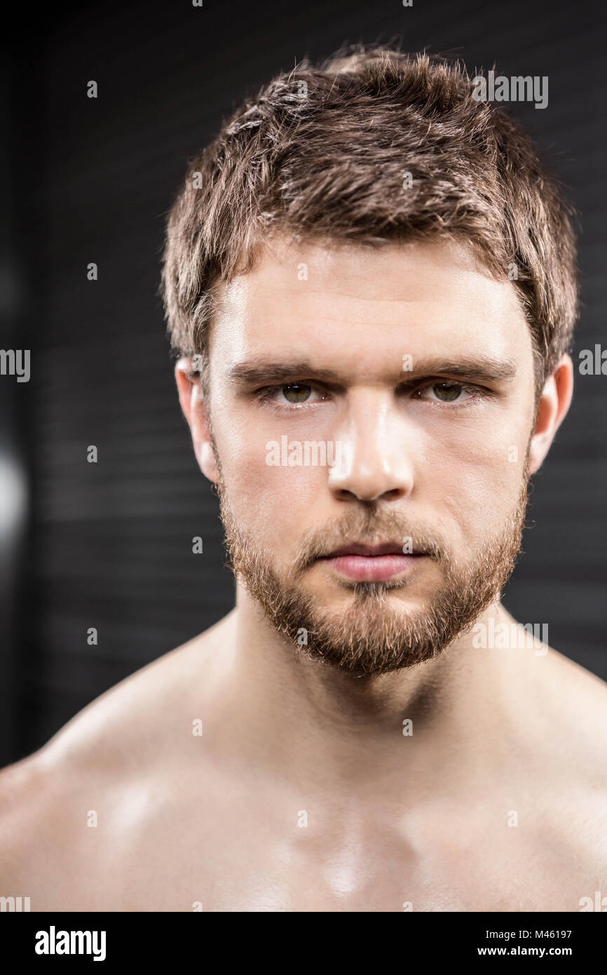 Determined muscular man looking at the camera Stock Photo - Alamy