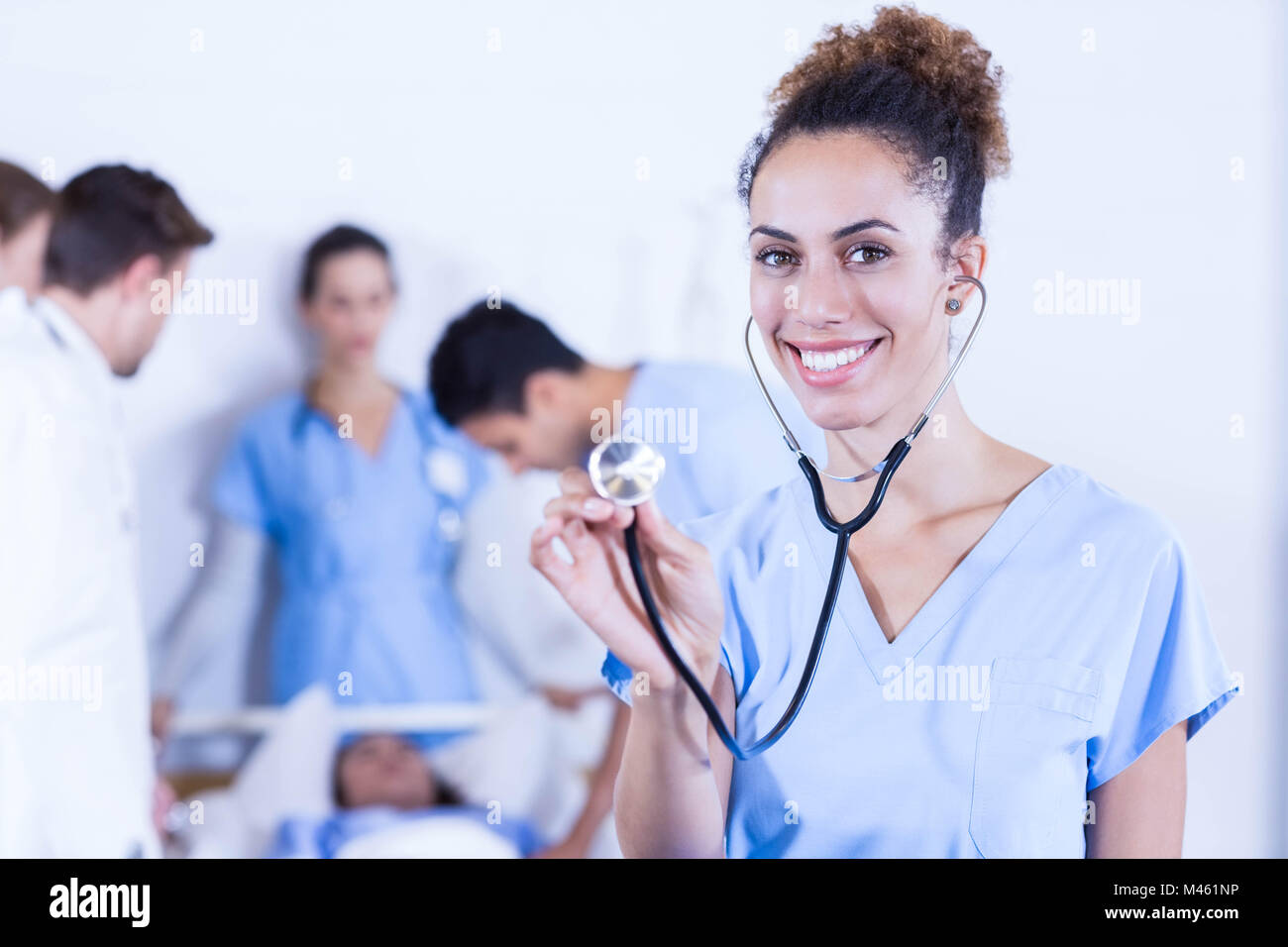 Female doctor showing stethoscope towards camera Stock Photo - Alamy