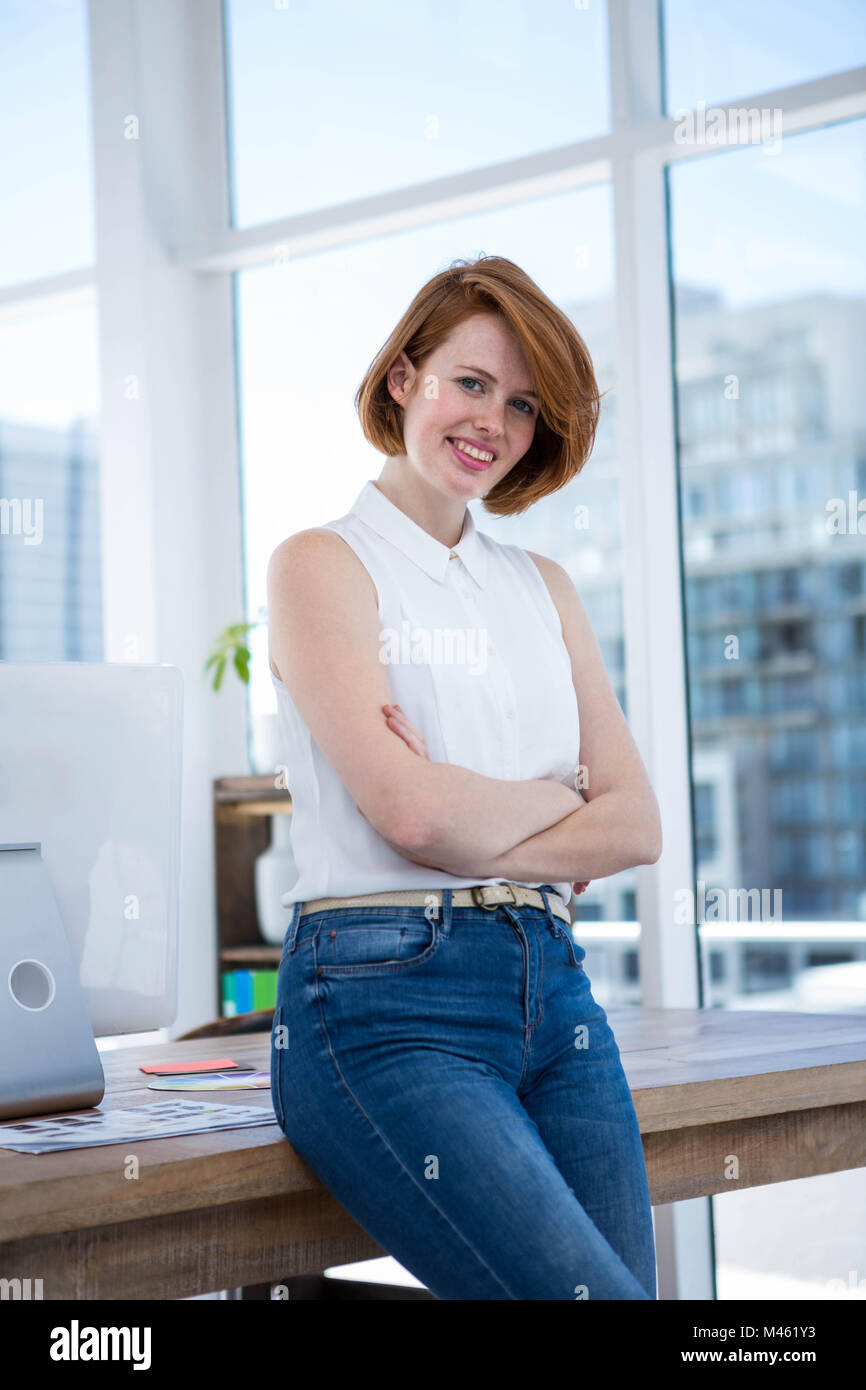 smiling hipster business woman with her arms crossed Stock Photo - Alamy
