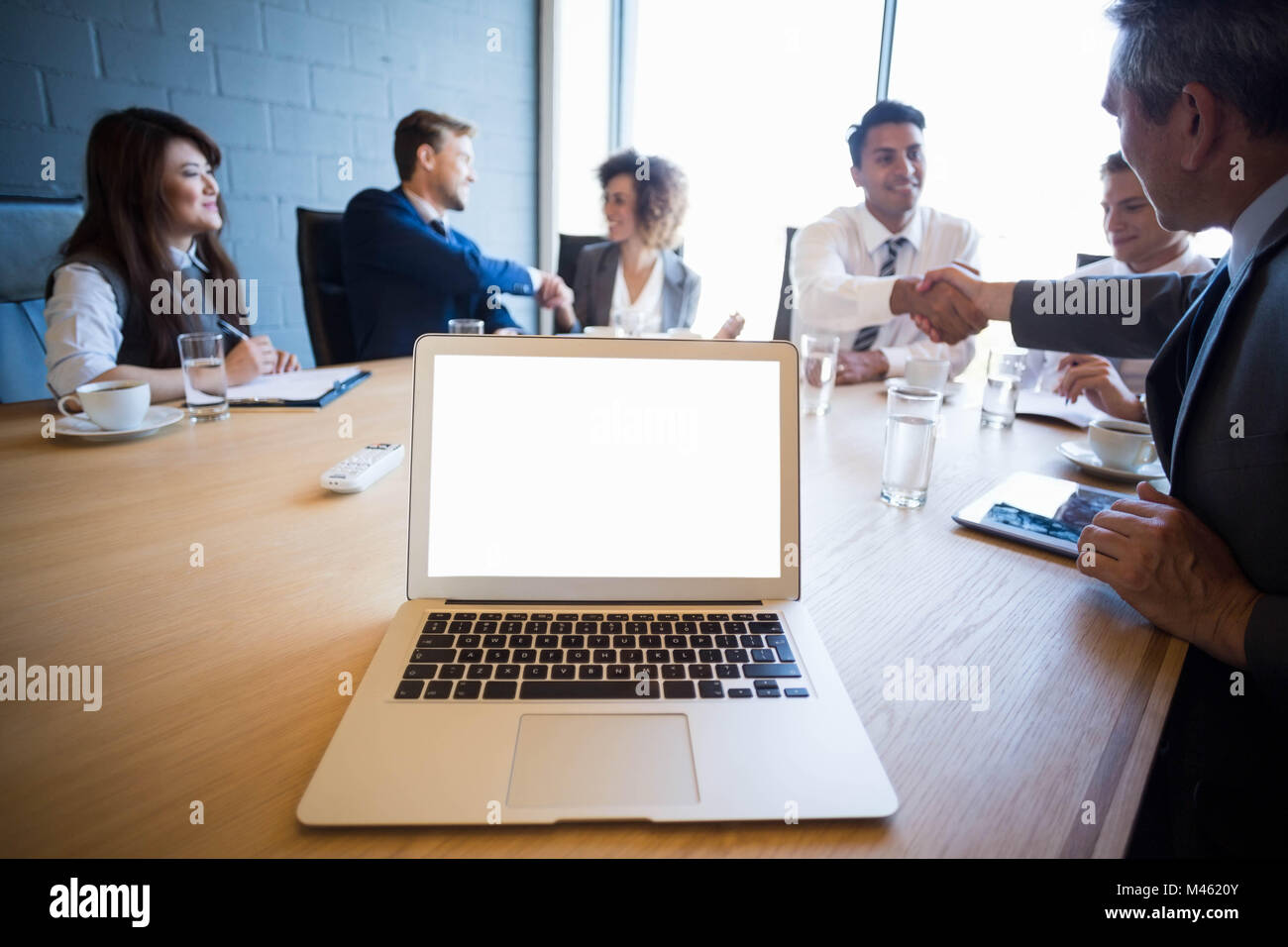Businesspeople having a discussion in conference room Stock Photo - Alamy