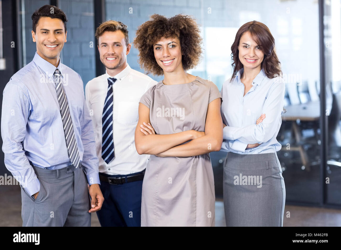 Portrait of confident business team in office Stock Photo - Alamy
