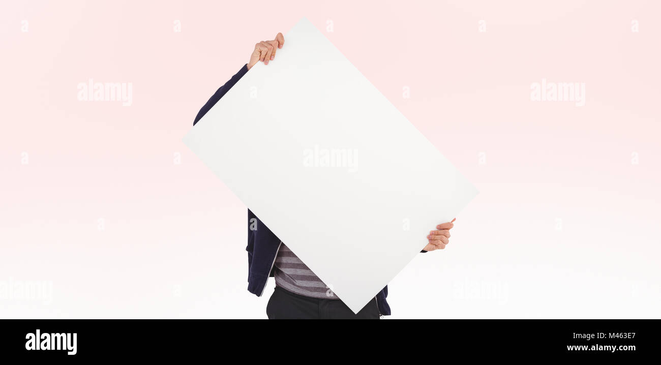 Composite image of man holding billboard in front of face Stock Photo ...
