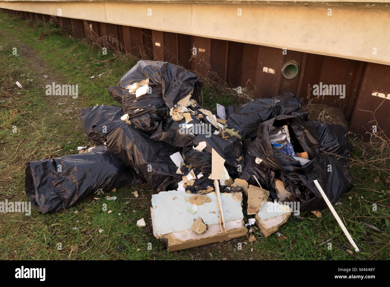 A pile of rubbish left on a public footpath Stock Photo - Alamy