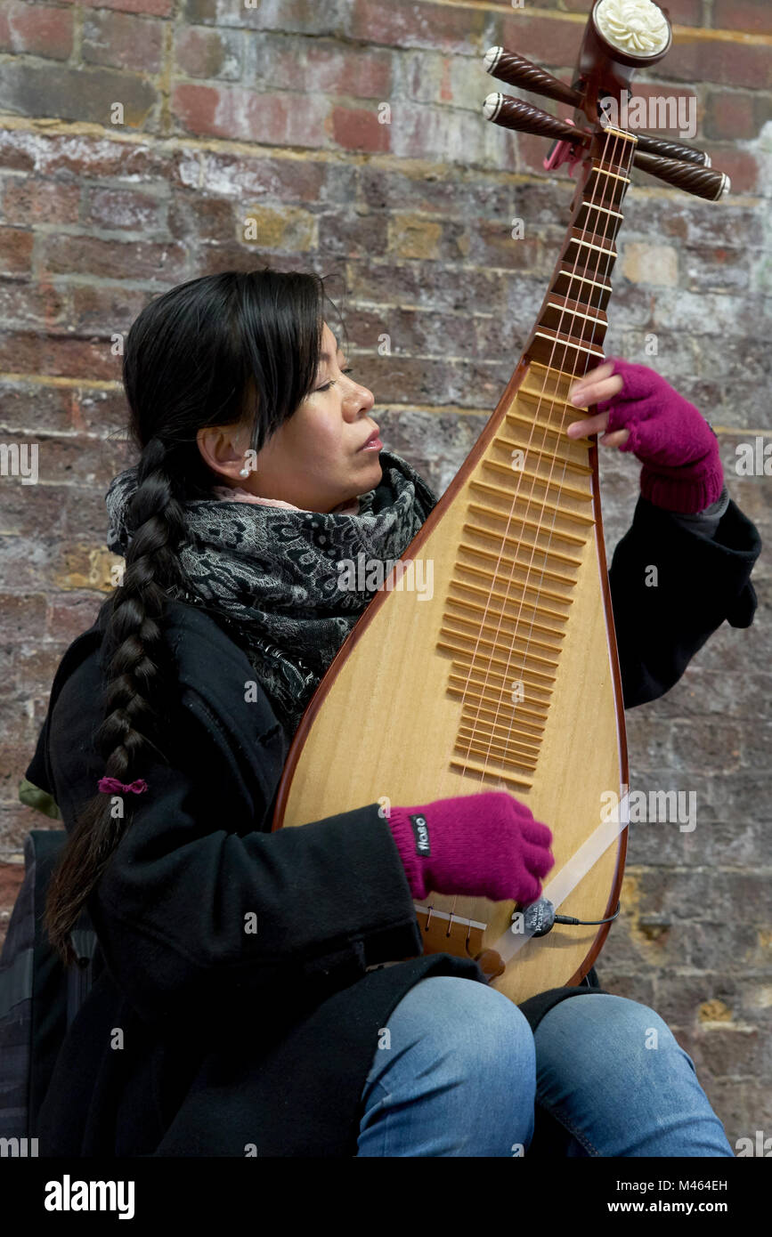 Woman playing pipa pear shape lute hi-res stock photography and images ...