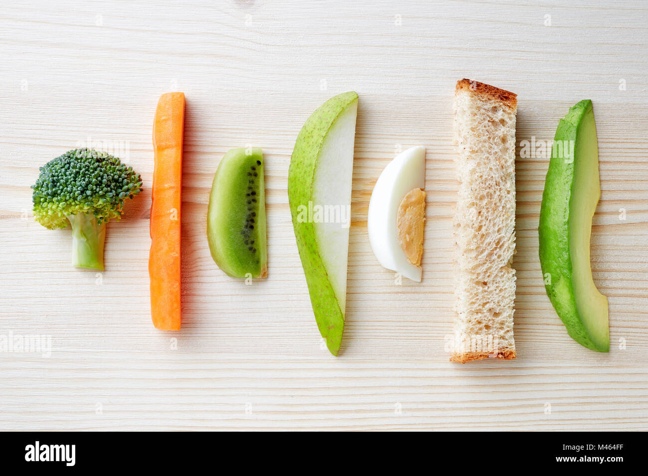 Baby finger food on wooden background, top view Stock Photo - Alamy