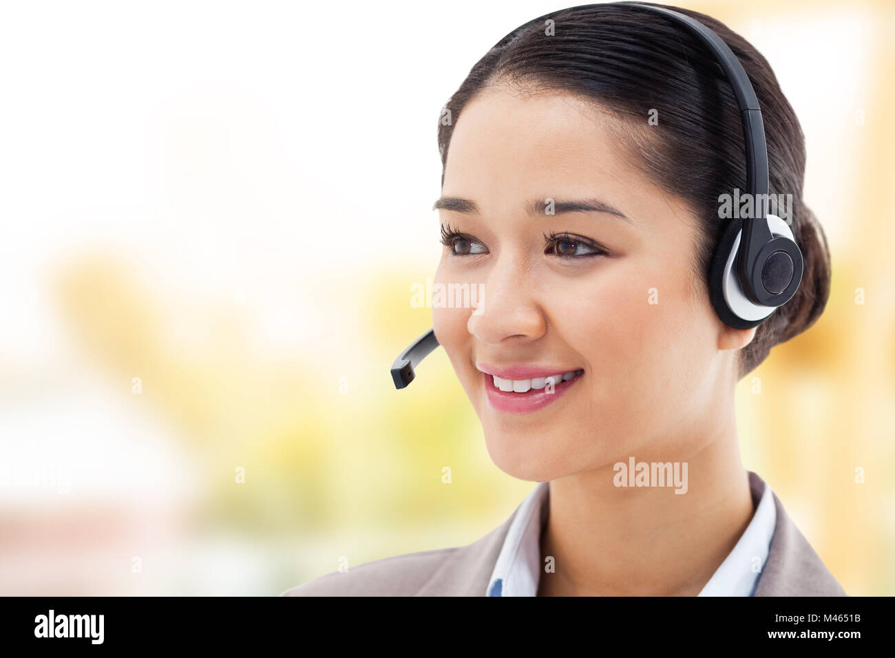 Composite image of happy operator posing with a headset Stock Photo - Alamy