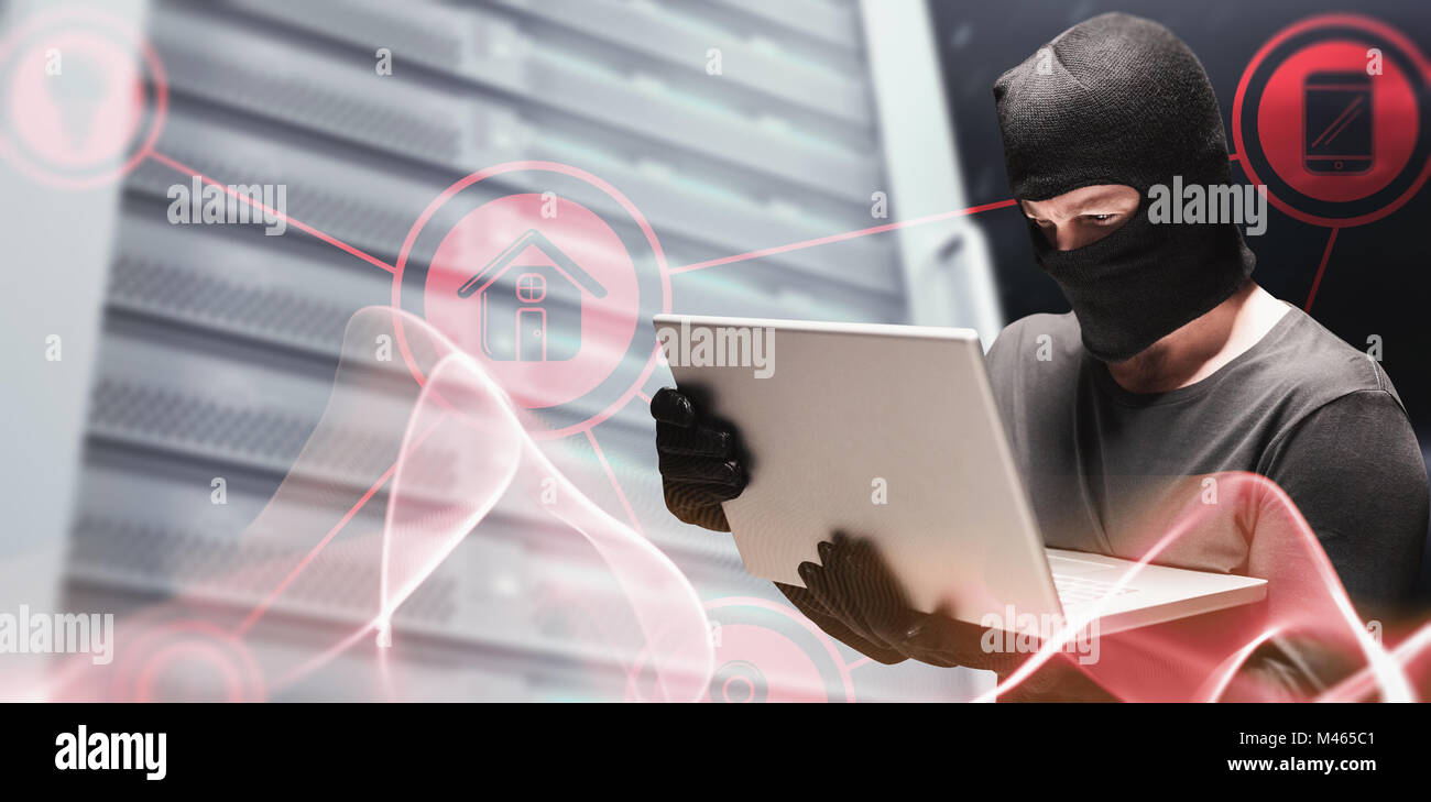 Composite image of hacker using laptop to steal identity Stock Photo ...