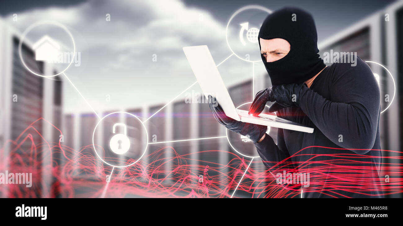 Composite image of hacker using laptop to steal identity Stock Photo ...