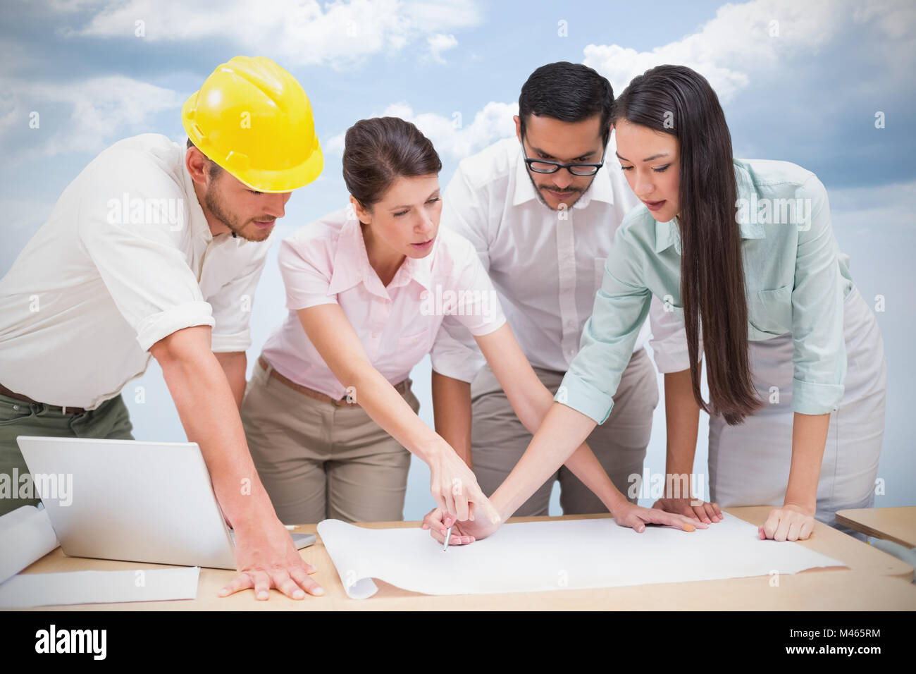 Composite image of architecture team working together at desk Stock ...