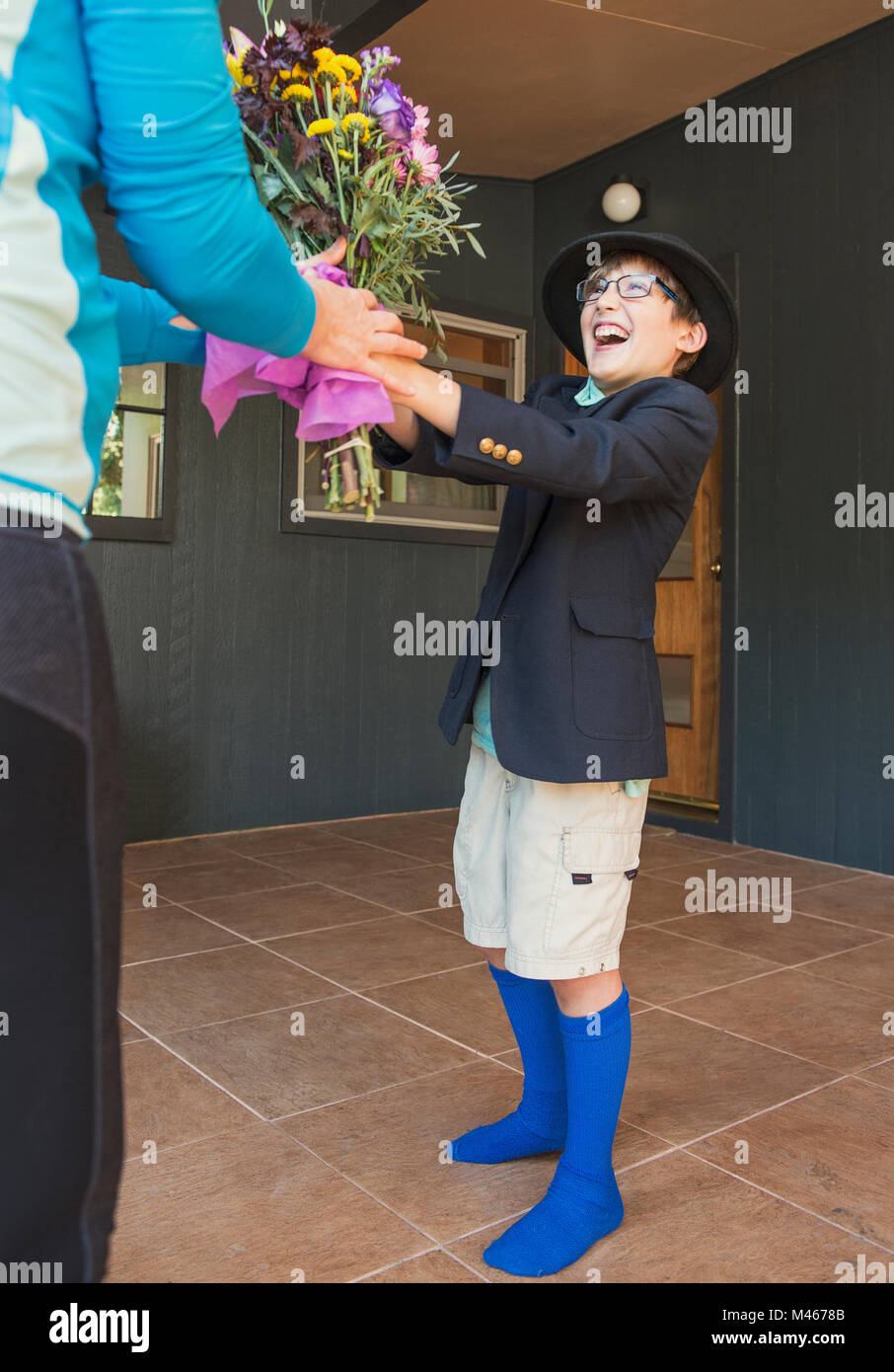 Boy holding flowers hi-res stock photography and images - Alamy