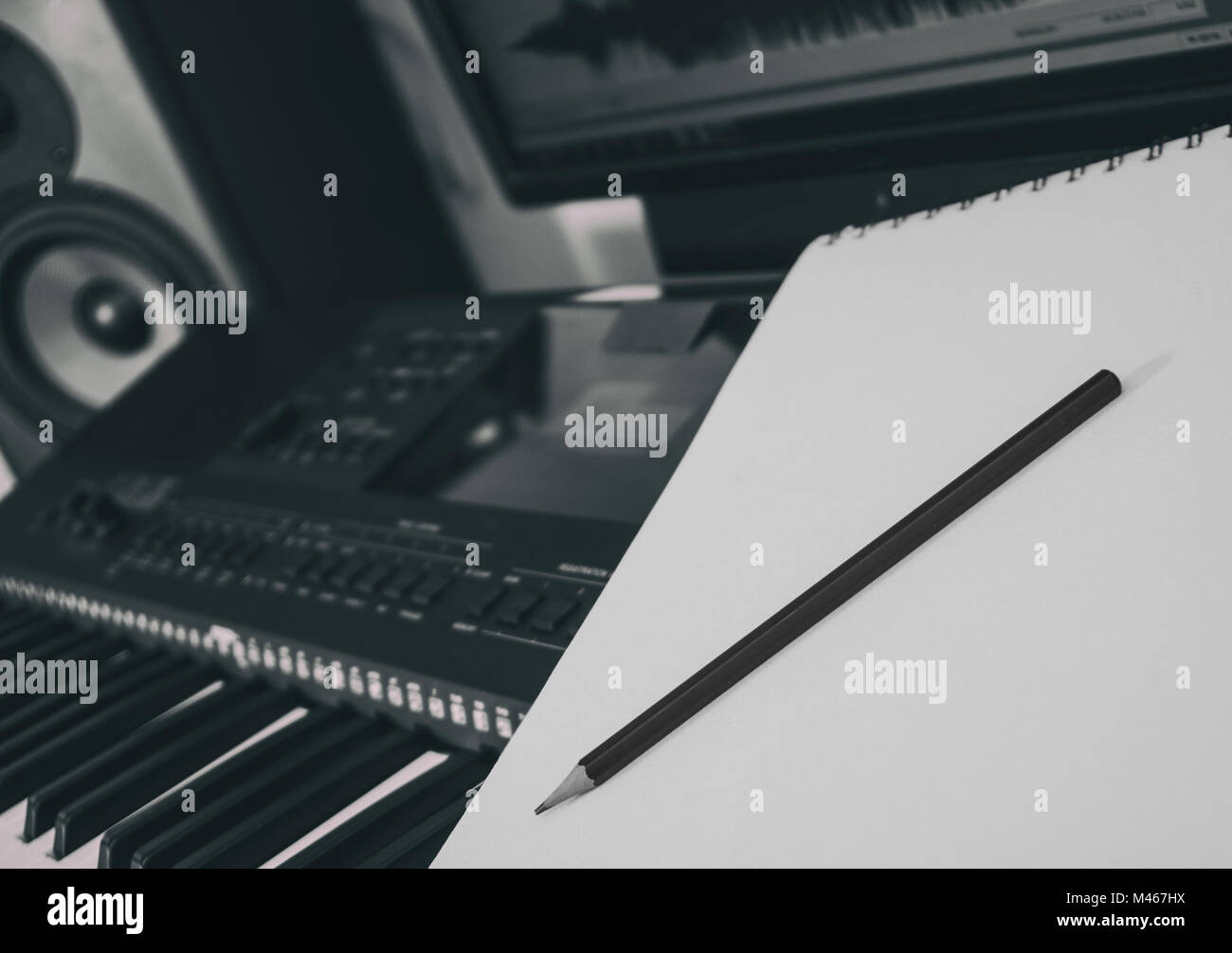 Piano keyboard, pen and sheet. Concept of composing song. Black and ...