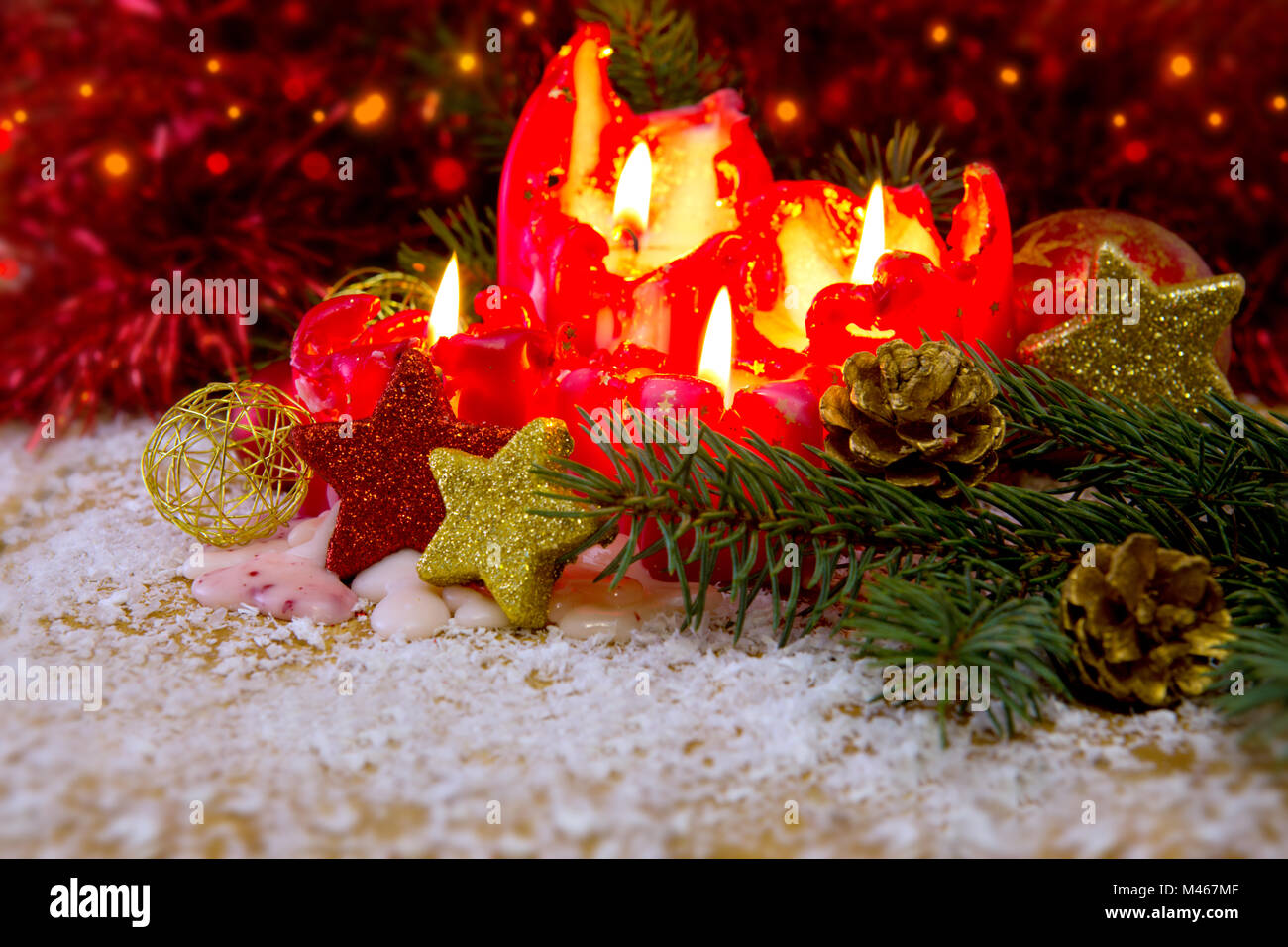Four red Advent candles with christmas decoration and snow Stock Photo ...