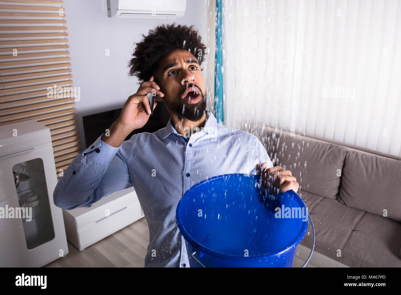 Water dripping into bucket hi-res stock photography and images - Alamy