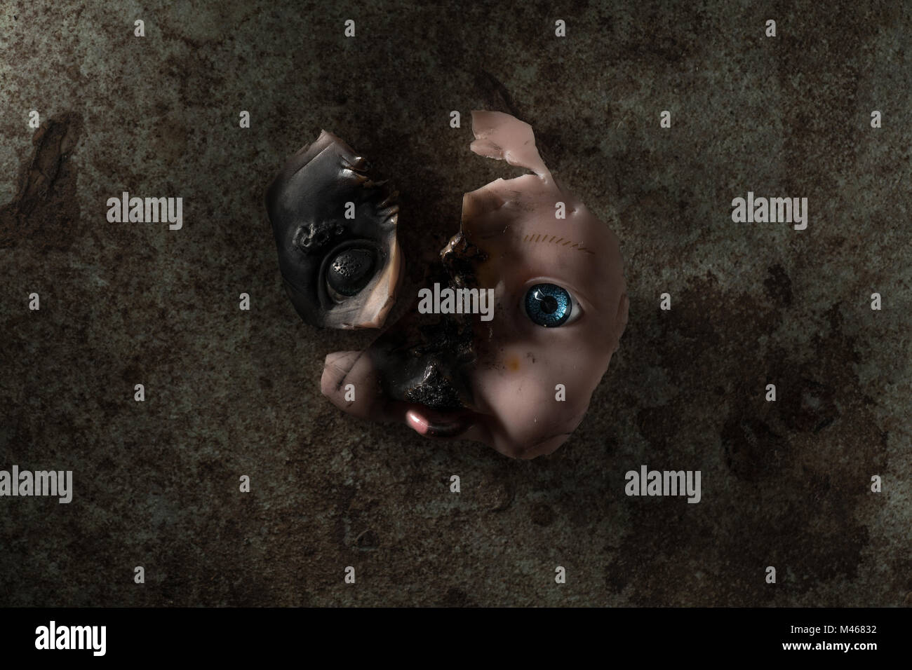 Burned Doll Face Ripped Off from Its Body Stock Photo - Alamy